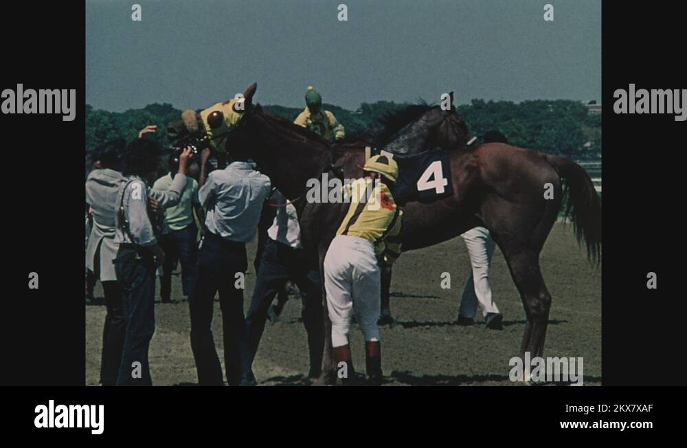 Jockeys dismount horses at Aqueduct Race Track in Queens, New York ...