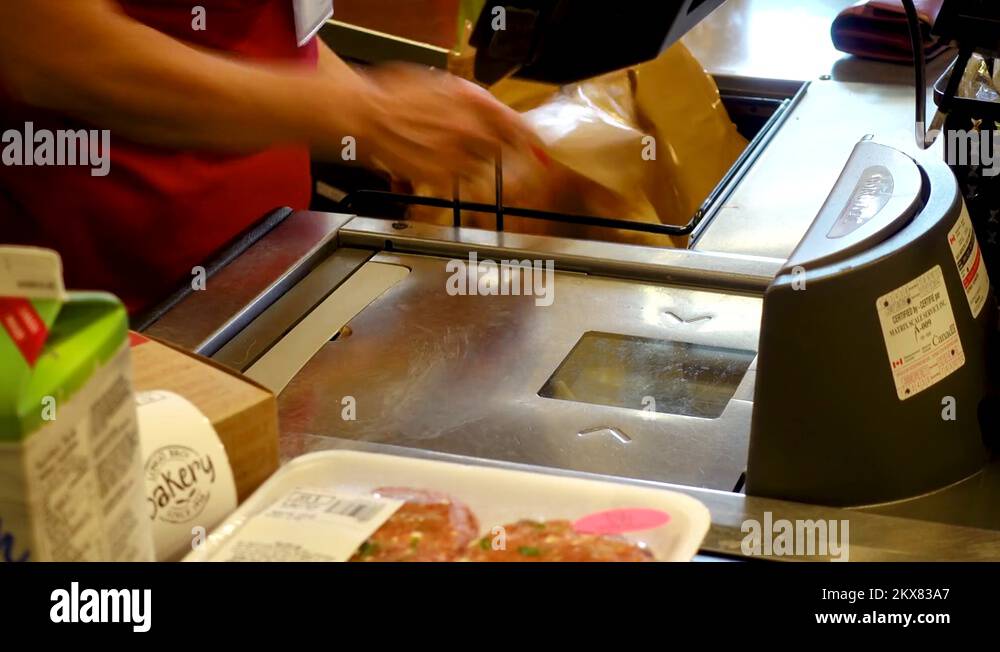Scanning grocery items in supermarket Stock Video Footage - Alamy