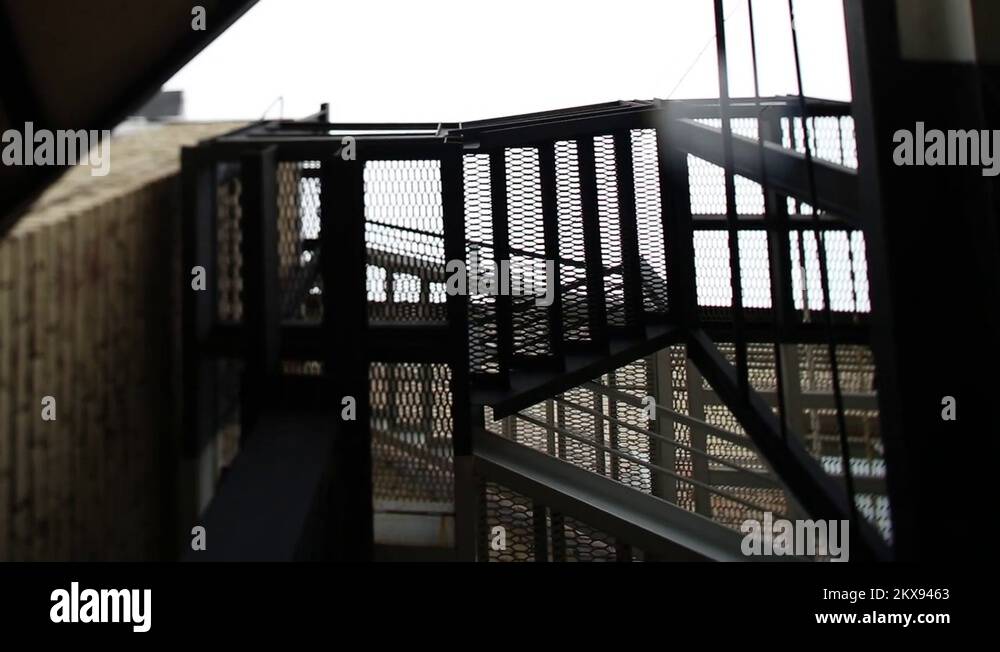 Fire Escape in Dark Alley. Footage. Typical emergency stairs from old ...