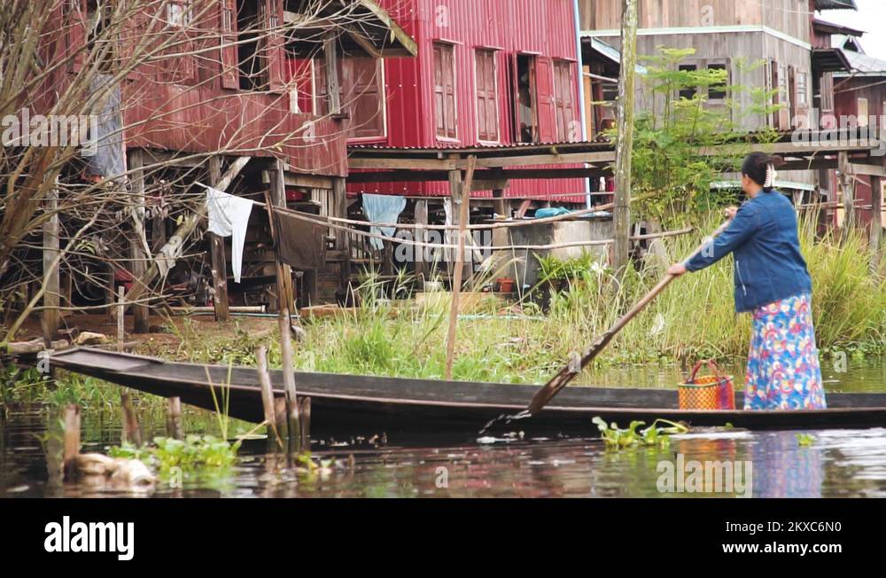 Burmese Locals Riding Boat Among Floating Village at Inle Lake, Myanmar ...