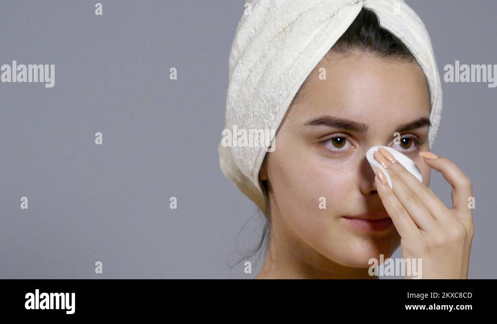 girl Making her face clean and fresh. Beautiful young shirtless woman ...