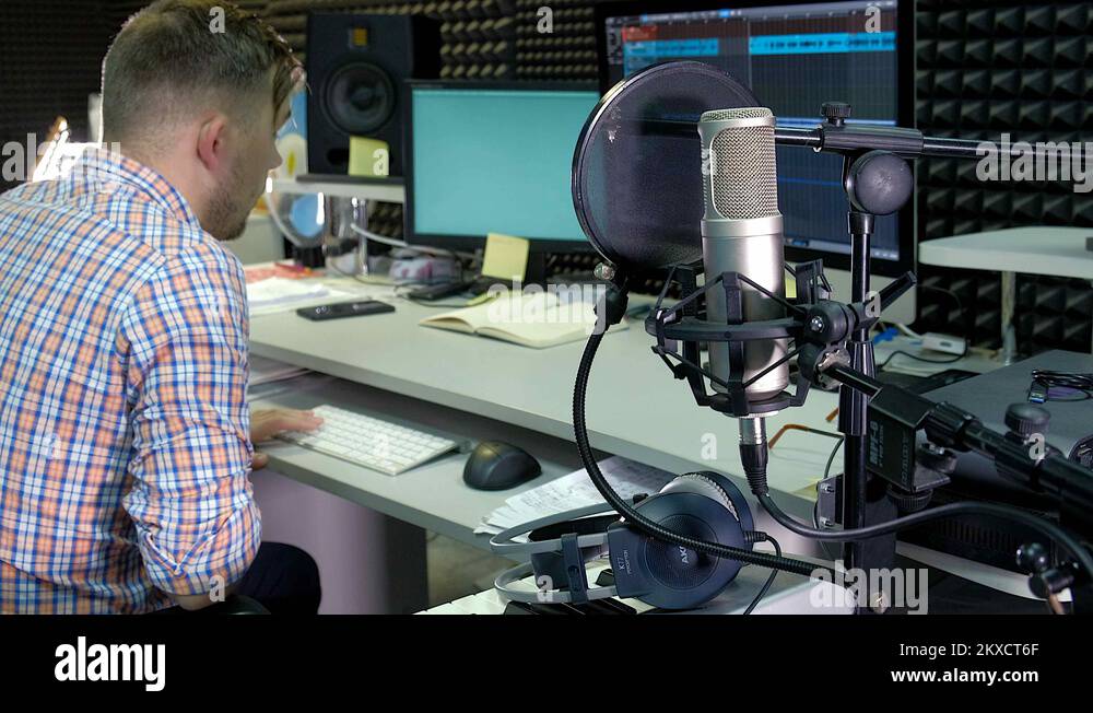 The audio editor is working on the audio track in the studio sound ...