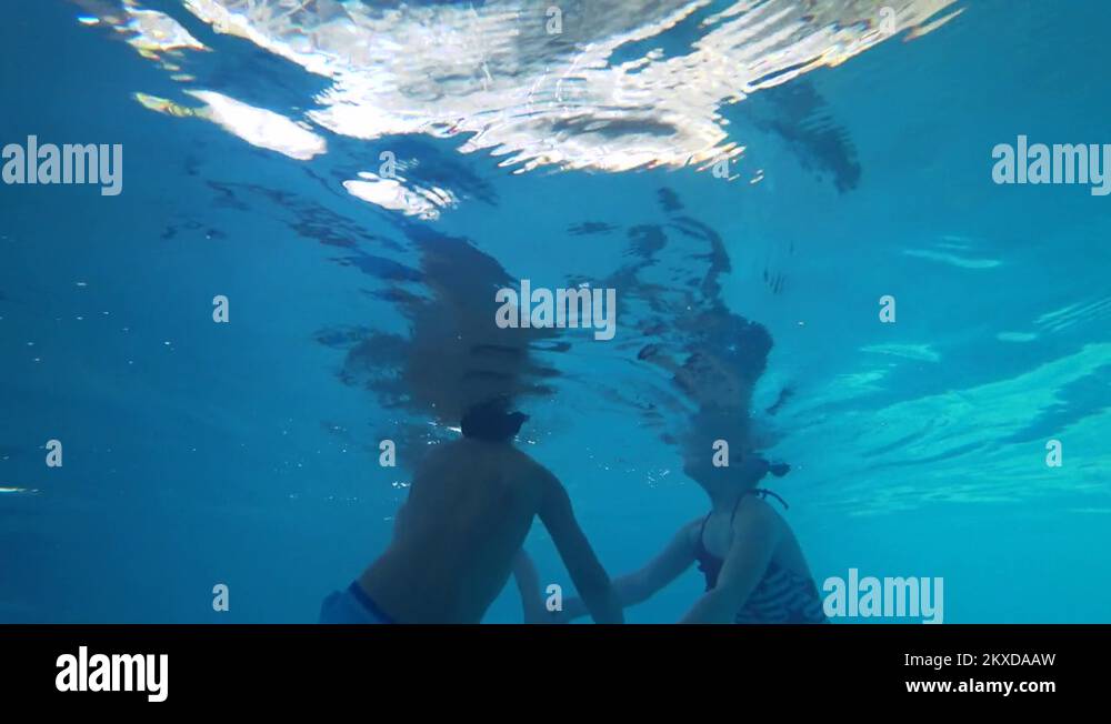 children swim in the pool, flippers and underwater glasses. 4k shooting ...