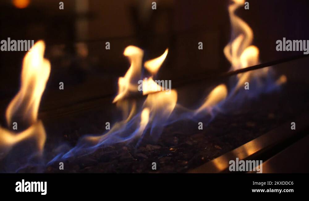 Fire flame Flames in a Modern Fireplace roaring gas burning outdoors at ...