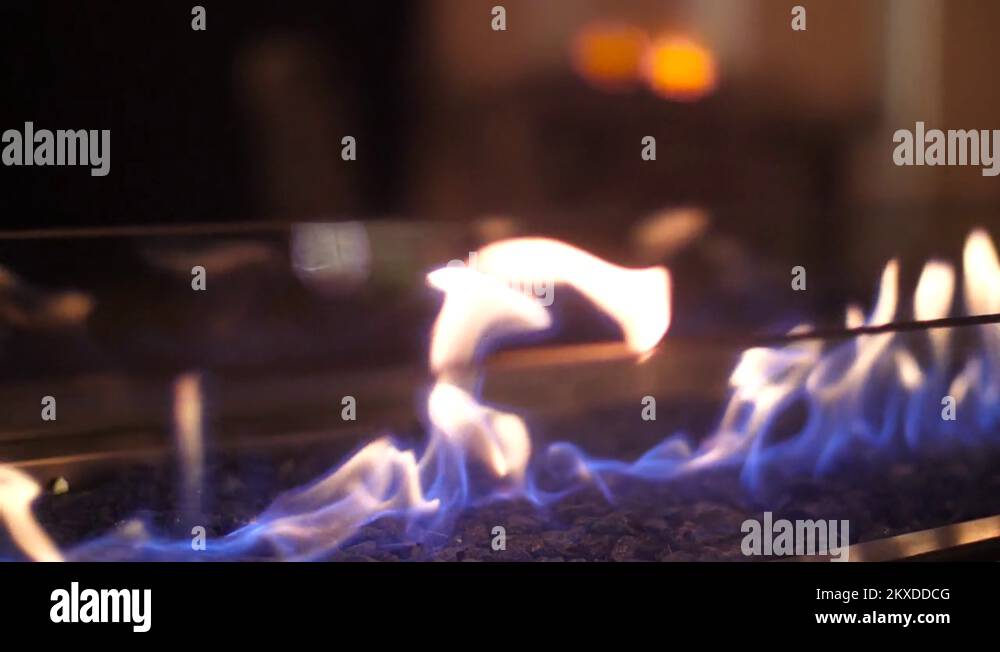 Fire flame Flames in a Modern Fireplace roaring gas burning outdoors at ...