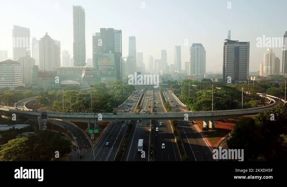Road intersection with skyscrapers background Stock Video Footage - Alamy