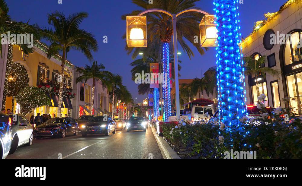 Luxury cars driving on Rodeo Drive in Beverly Hills, Los Angeles ...