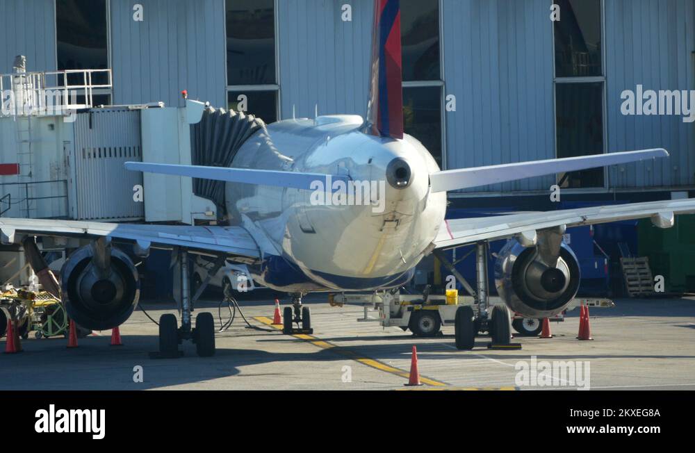 Fuselage of a passenger aircraft with the engine running at the airport ...