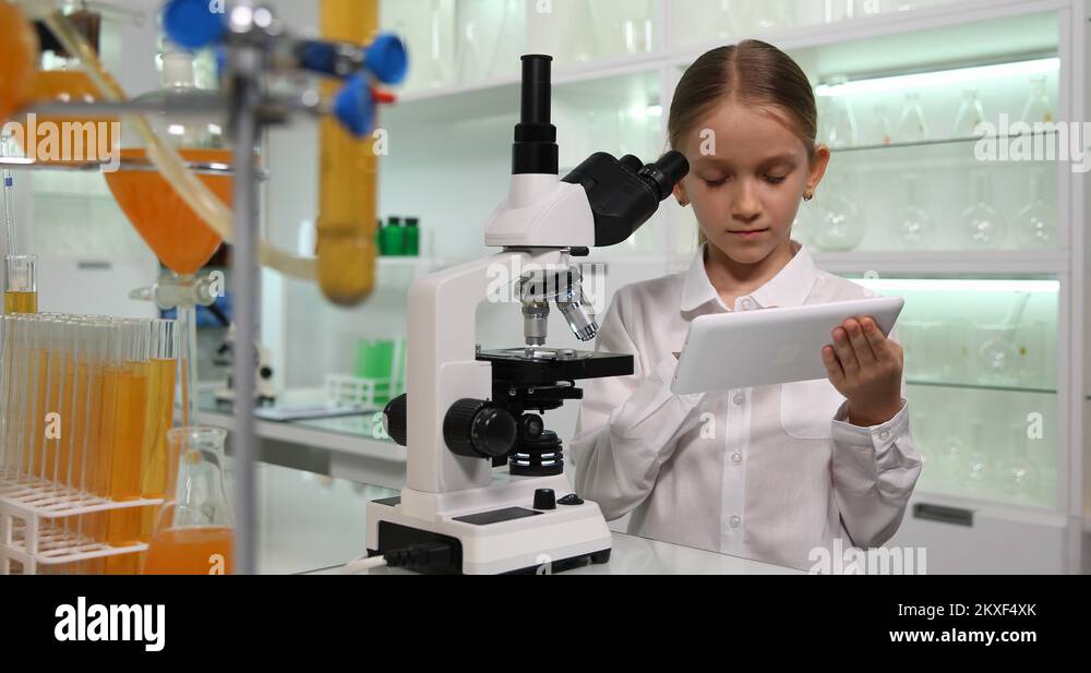 Girl using microscope in science lab Stock Videos & Footage - HD and 4K ...