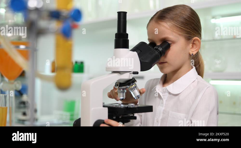 Child Using Microscope in School Chemistry Lab, Student Studying ...