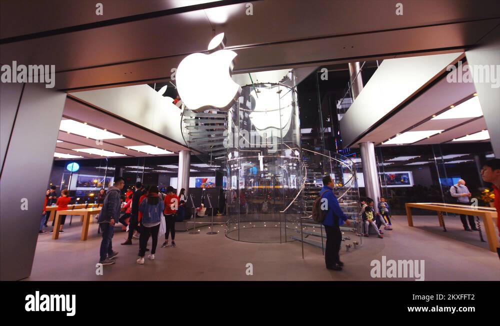 Big logos of Apple in the first Apple Store in Hong Kong, China. Spiral ...