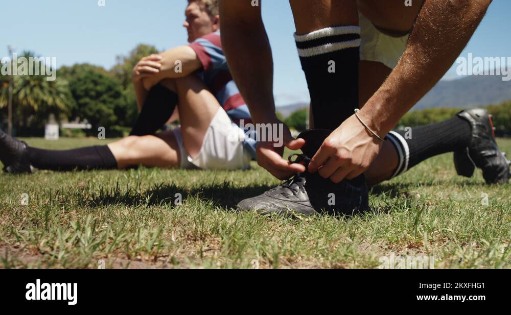 Rugby players tying the shoe lace on the field 4K 4k Stock Video ...