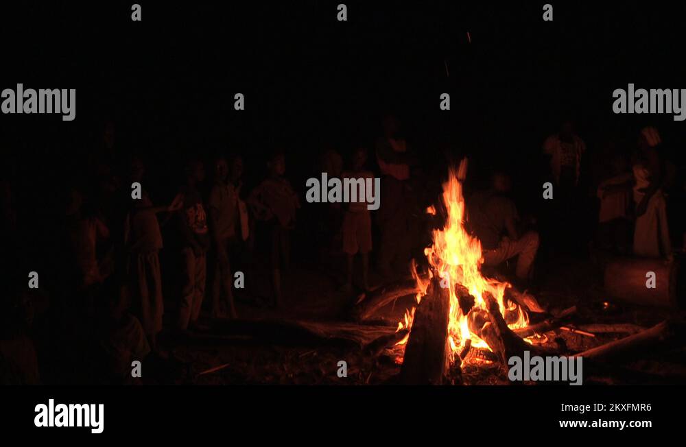 African people sitting around a fire in the night Stock Video Footage ...
