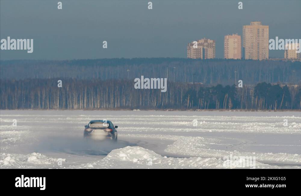 Blue SUV drifting on ice of lake. Winter drift. Luxury SUV in deep snow ...