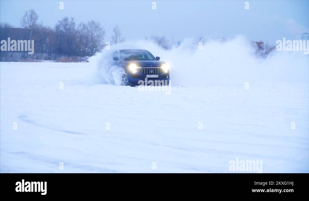 Blue SUV drifting on ice of lake. Winter drift. Luxury SUV in deep snow ...