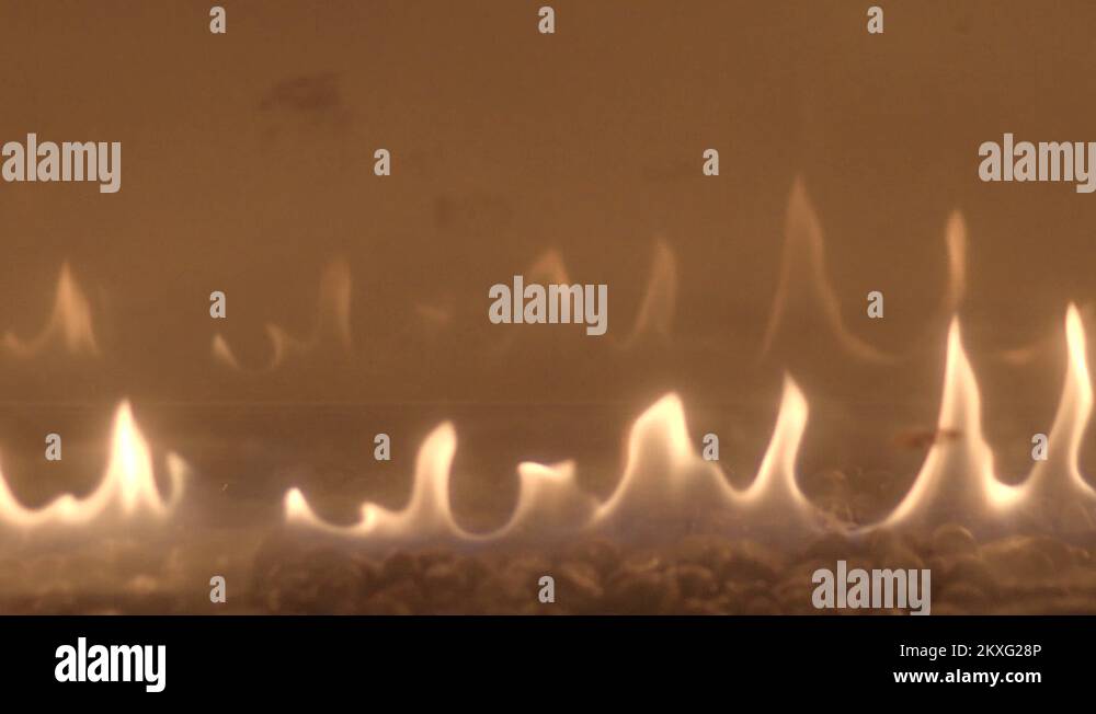 Fire flame Flames in a Modern Fireplace roaring gas burning indoor at ...