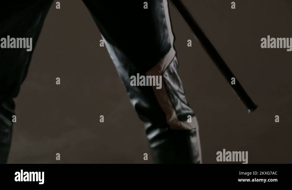 Man holds an LED stick in his hand. The light in the LED fingers moves ...