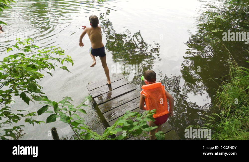 Boys jump into river Stock Videos & Footage - HD and 4K Video Clips - Alamy