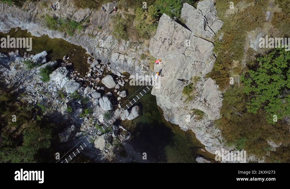 Rope Bridge Over Rocky River Overhead Stock Video Footage - Alamy