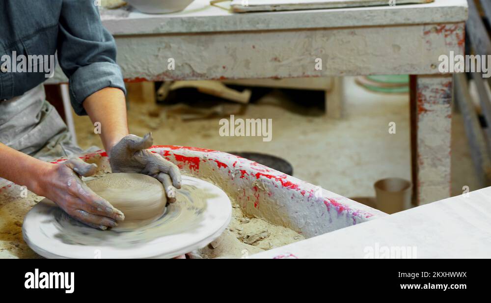 Mid section of female potter molding clay 4k Stock Video Footage - Alamy