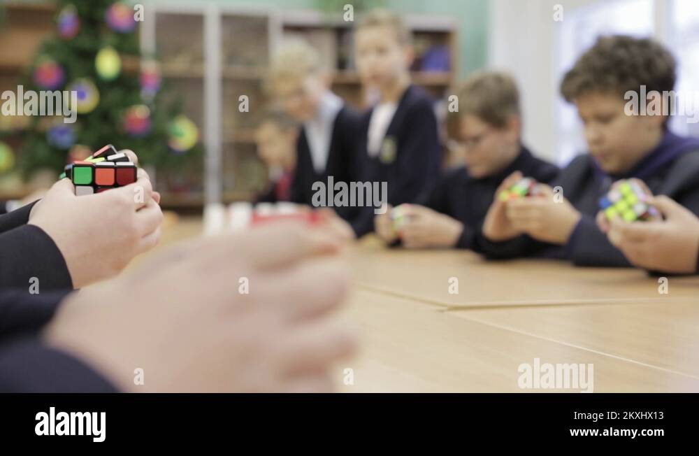 Kids playing with rubik's cube at school Stock Video Footage - Alamy