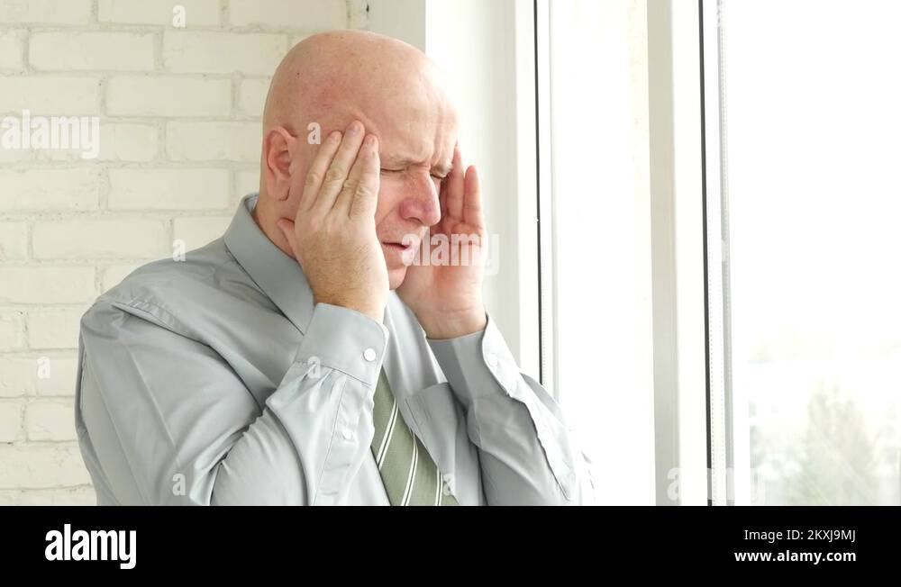 Tired Businessman Suffering a Migraine Big Headache Disturbing Pain on ...