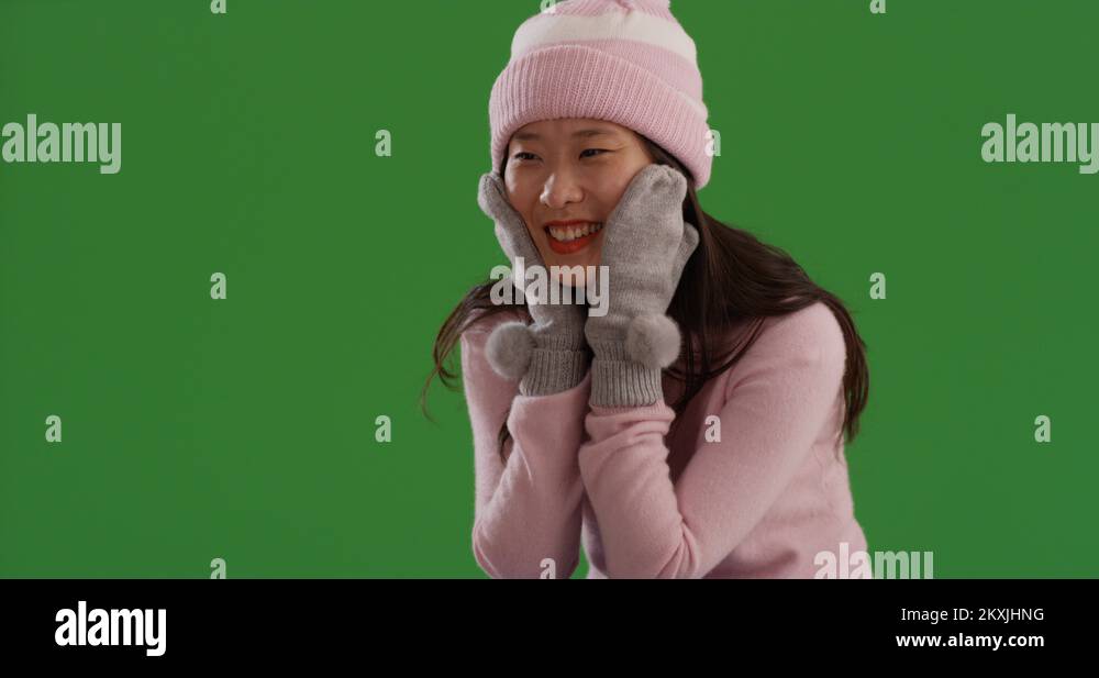 Pretty Chinese Girl Wearing Winter Clothing Posed For Green Chroma Key