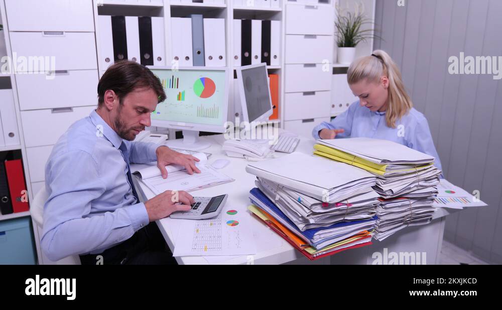 Team of Bookkeepers Making Calculation Monthly Tax Report in ...