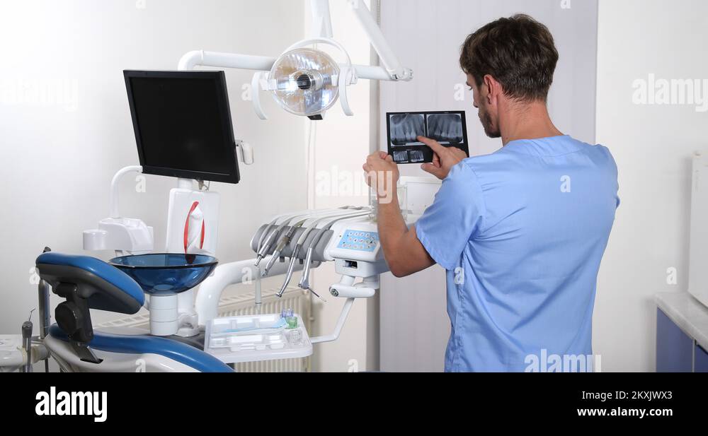 Dentist Doctor Man Check Teeth Treatment Examining X Ray in Dental ...
