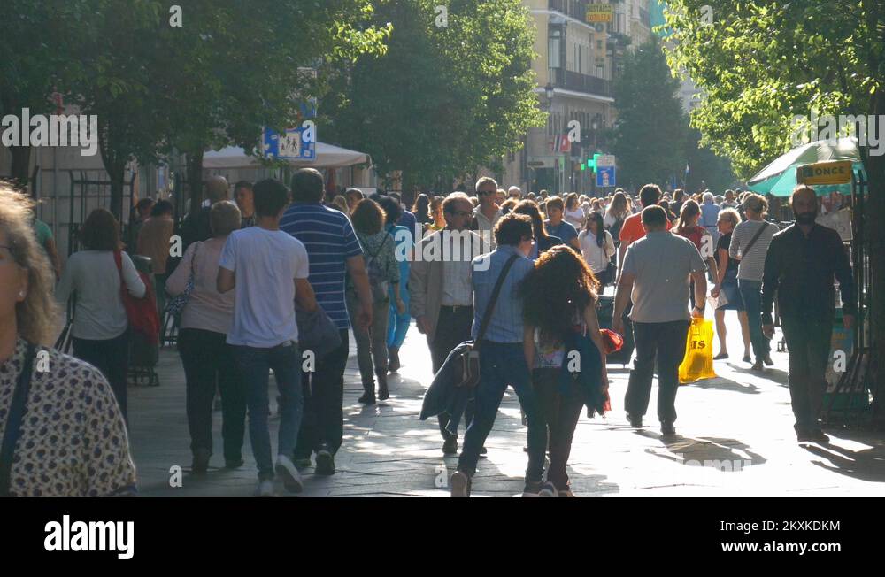 Crowded pedestrian zone in the sun Stock Video Footage - Alamy