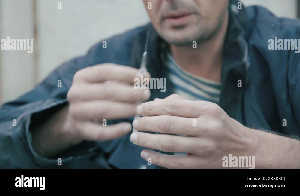 Man prepares a syringe for injection of drugs 4K Stock Video Footage ...
