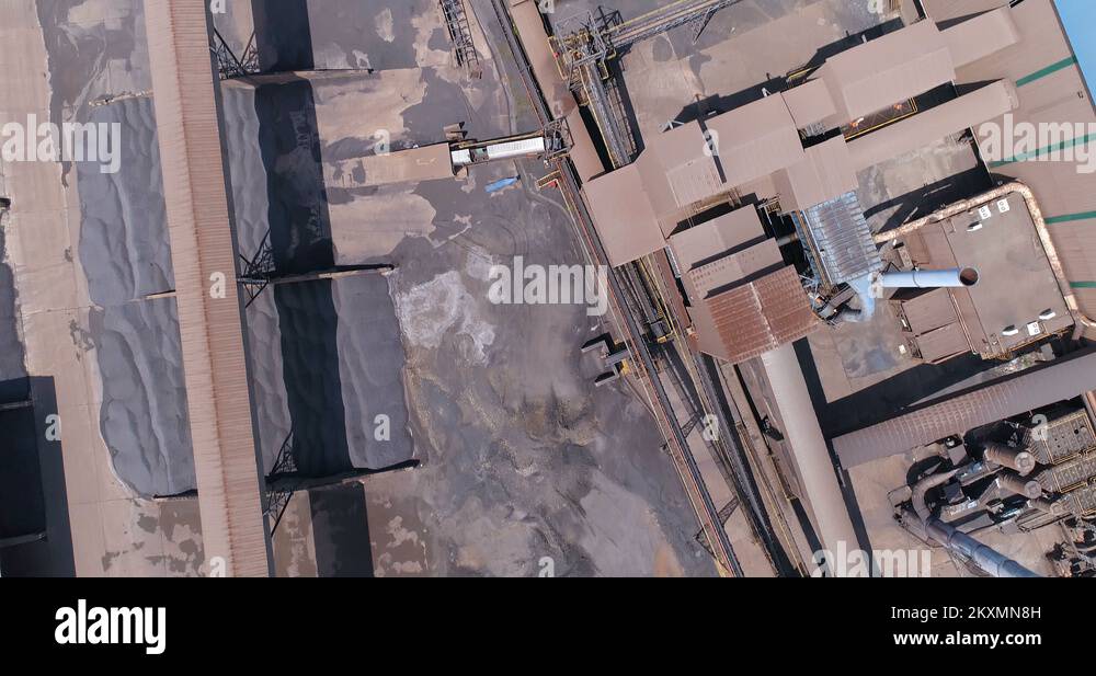 Dirty mine smelter complex viewed from above with conveyor passages ...