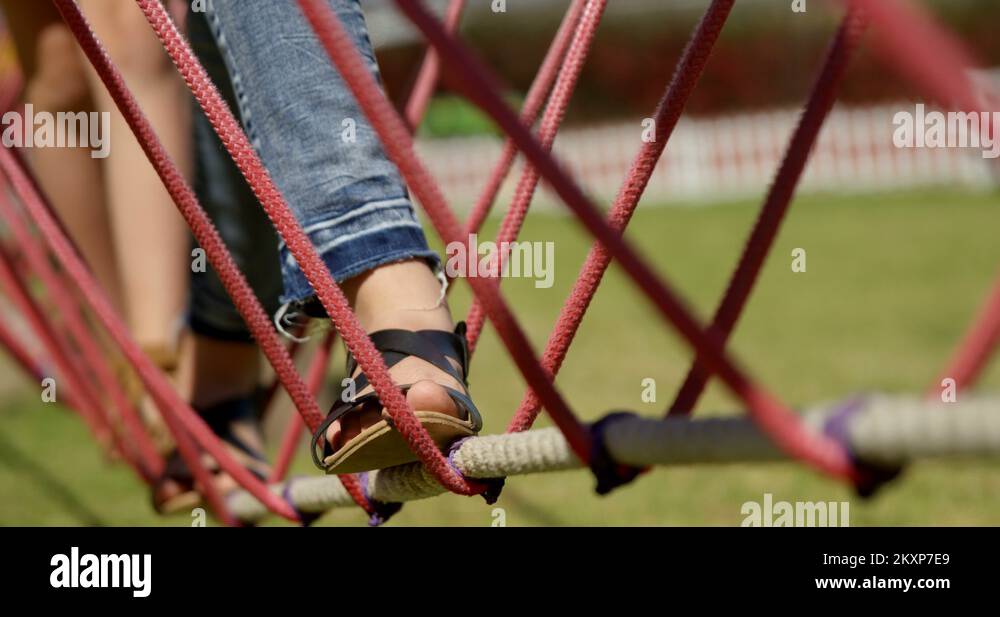 Kids walking on a rope bridge in the garden 4k Stock Video Footage - Alamy