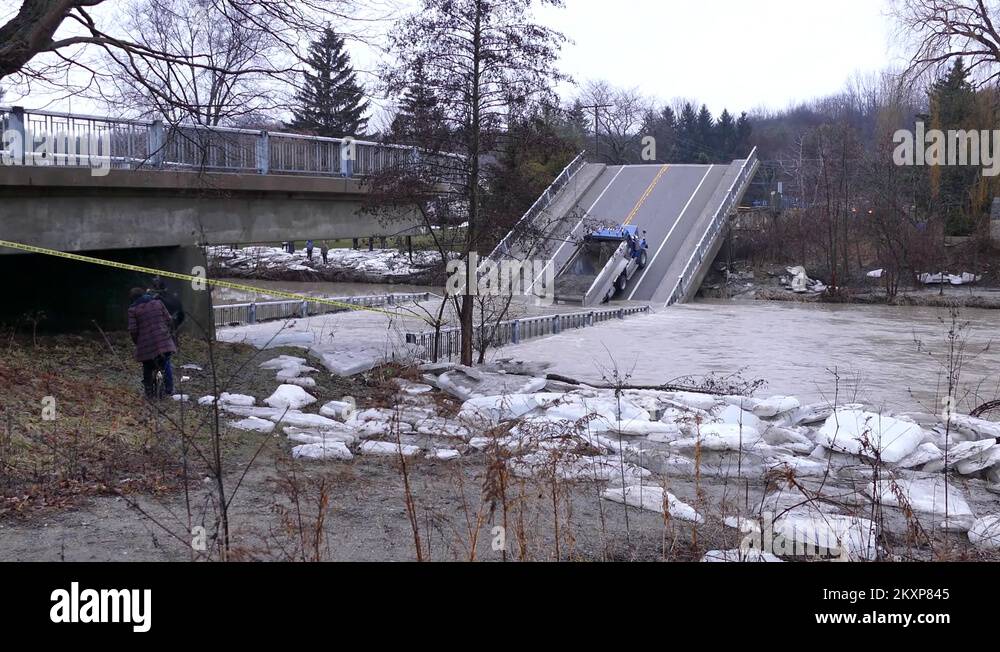 Bridge collapses into river during severe storm and flash flooding ...