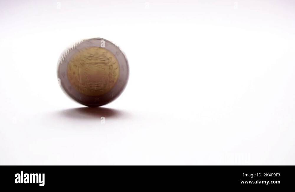 2 Euro coin spinning in slow motion against white background Stock ...