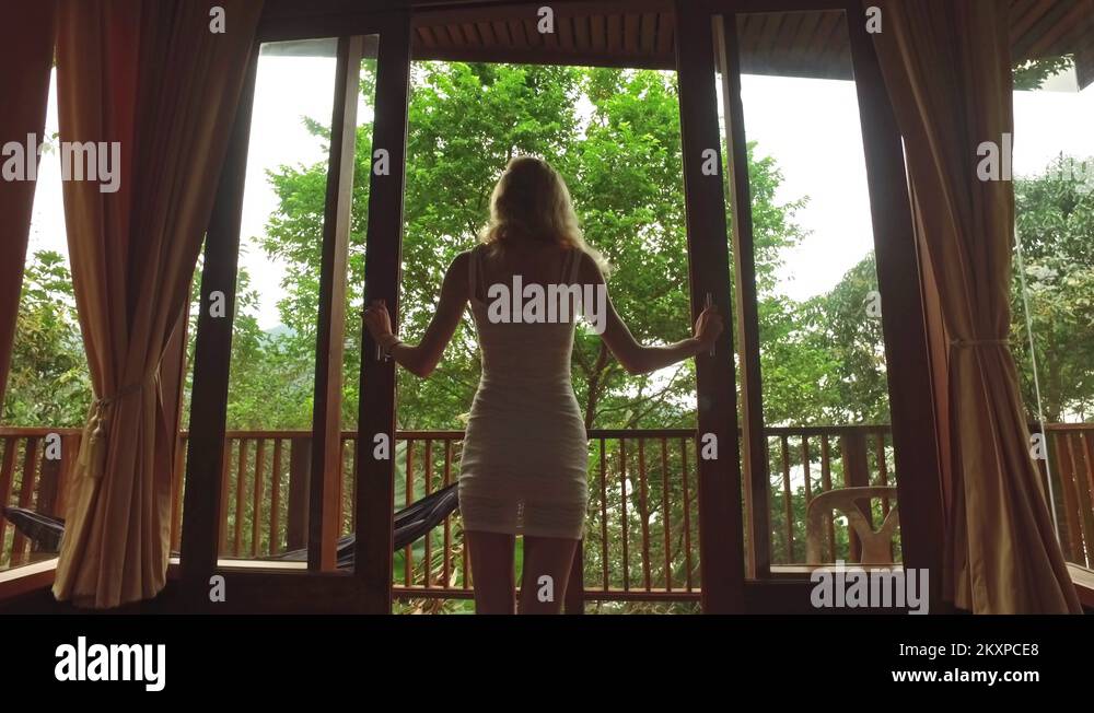 Beautiful Sexy Girl Opens The Door To A Balcony In The Tropics Stock Video Footage Alamy