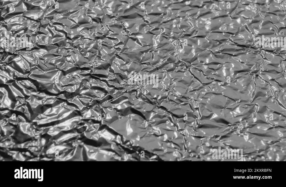 Crumpled sheet of thin metal. The surface with unique texture. Smooth ...