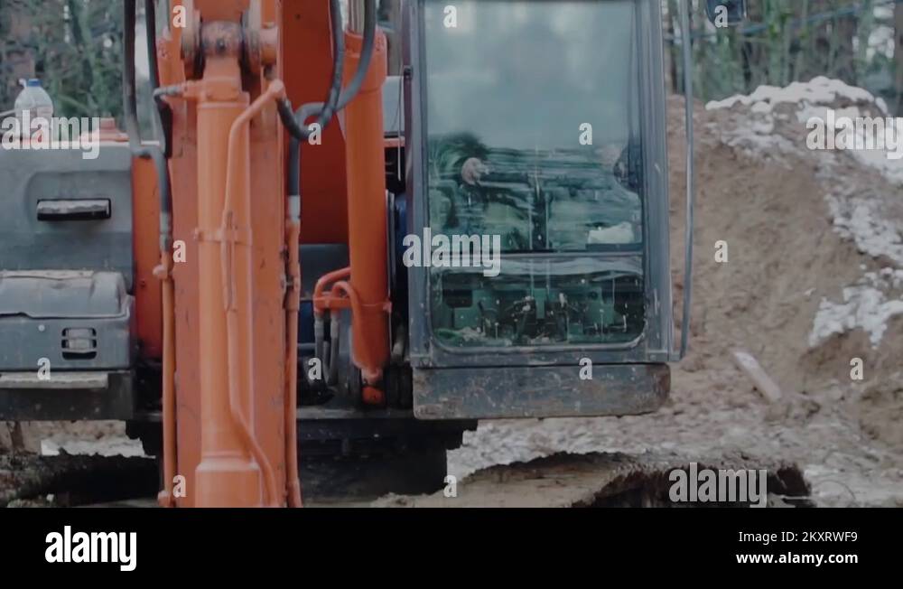 Loader backhoe, excavator digging a trench. Clip. Work of excavating ...