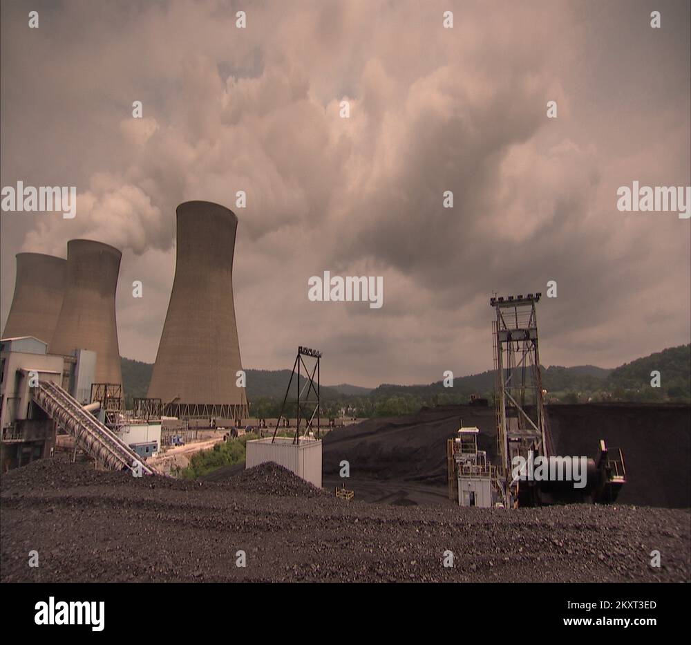 Pan right to left from cooling towers to view John E. Amos coal power ...