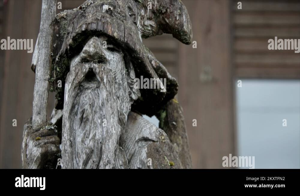 CU face and staff of carved statue of Tolkien's Gandalf the wizard ...