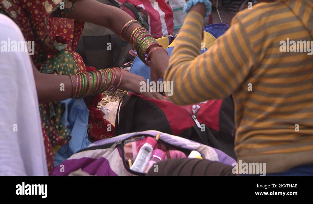 Hindu women packing and preparing for Kumbh Mela, Allahabad, India ...