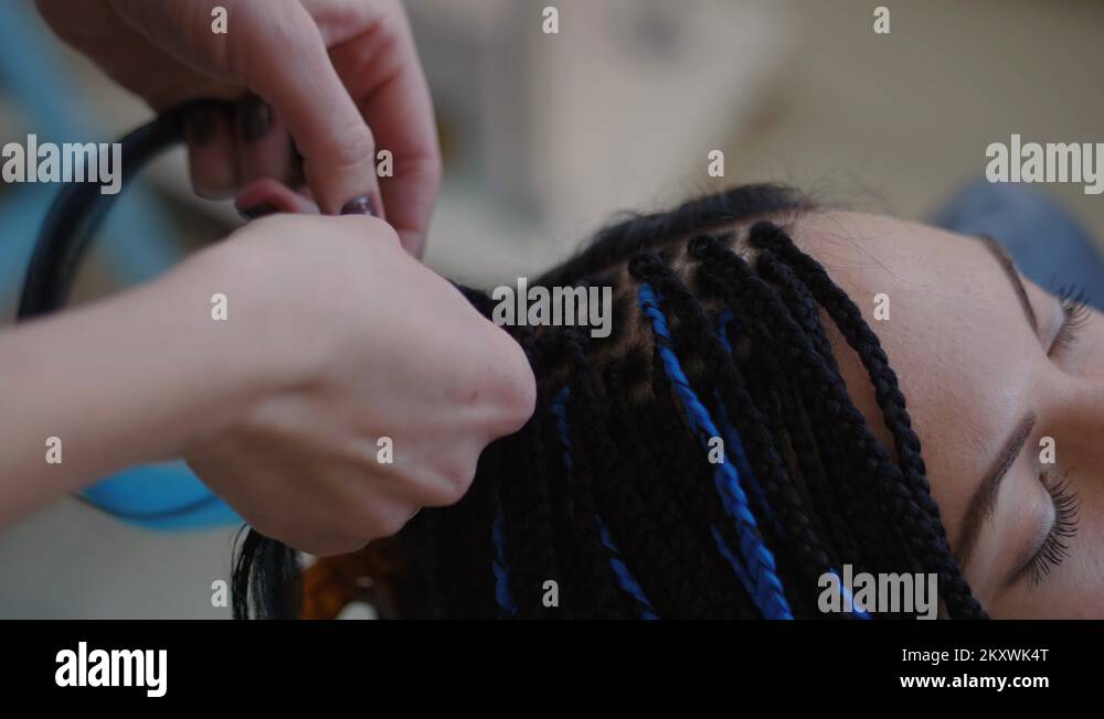 Process of weaving African braid with kanekalon. Small African braids ...