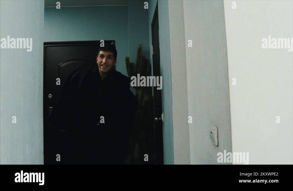 Young Man Returning Home After Work. Office worker happy to be home ...