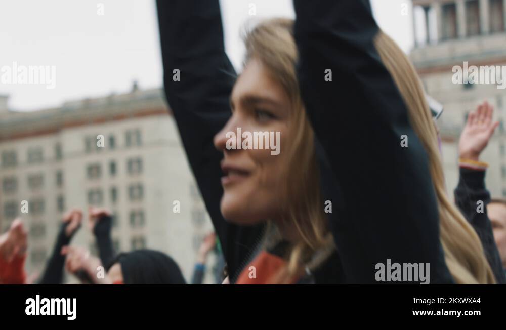 Russian model Natalia Vodianova stretching with crowd of people before ...