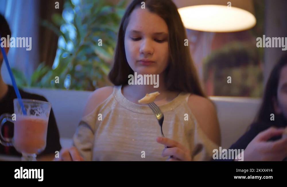kids girl group family of people eat pizza at a cafe. close-up children ...