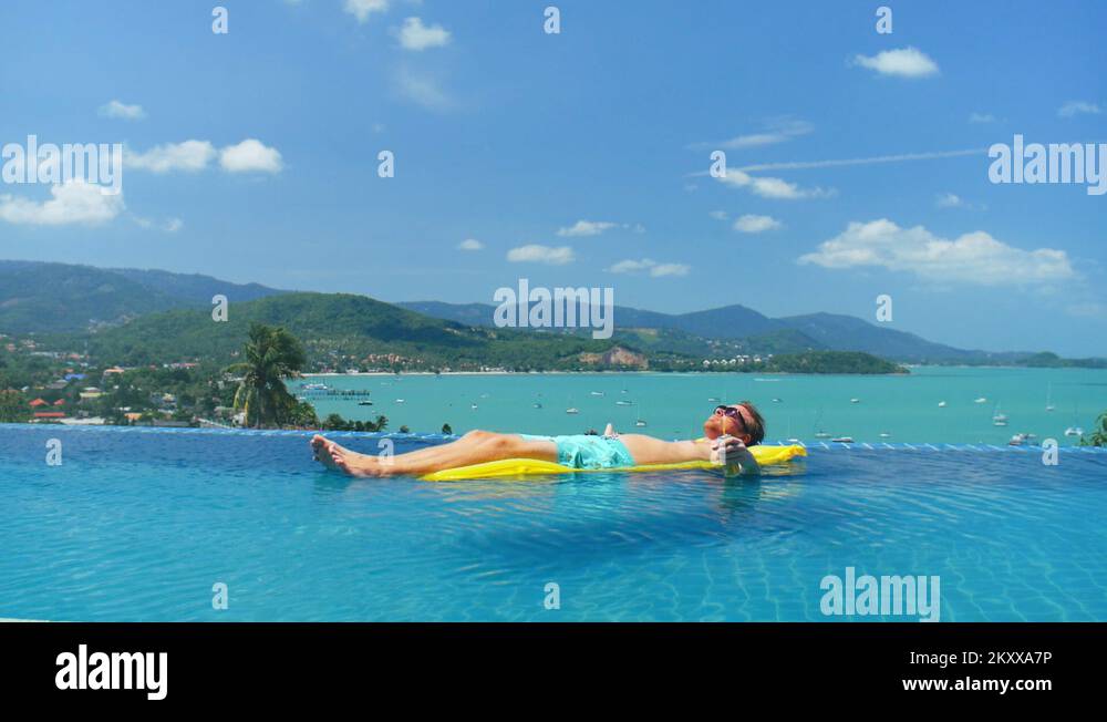 Handsome man floating in pool Stock Videos & Footage - HD and 4K Video ...