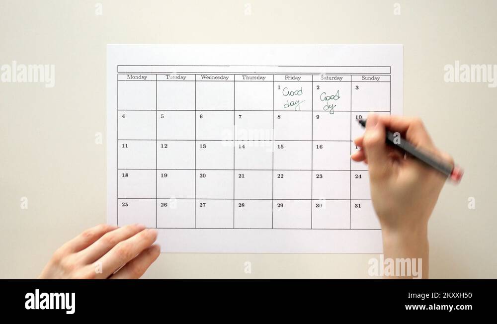 Sign the day in the calendar with a pen, draw a good bad day Stock ...