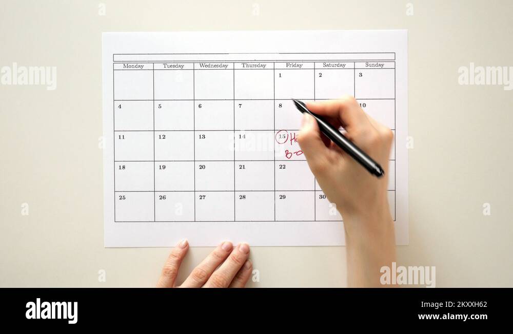 Sign the day in the calendar with a pen, draw a birthday Stock Video ...