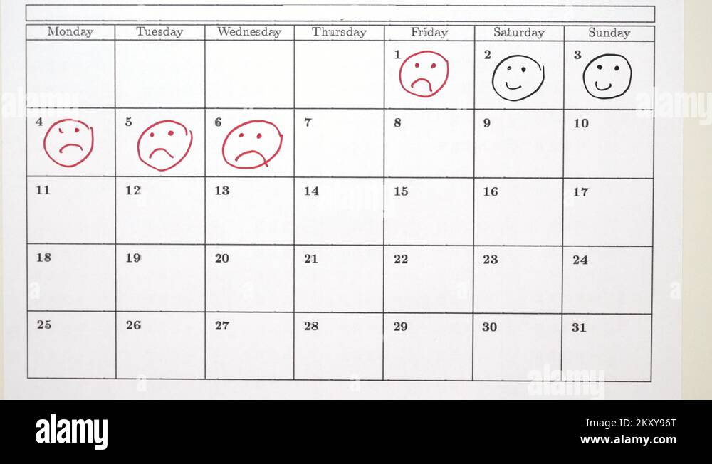 Sign the day in the calendar with a pen, draw a smile Stock Video ...