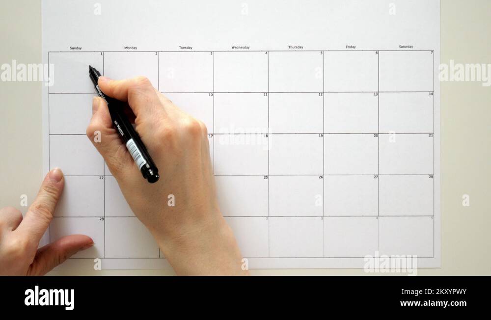 Sign the day in the calendar with a pen, draw a smile Stock Video ...